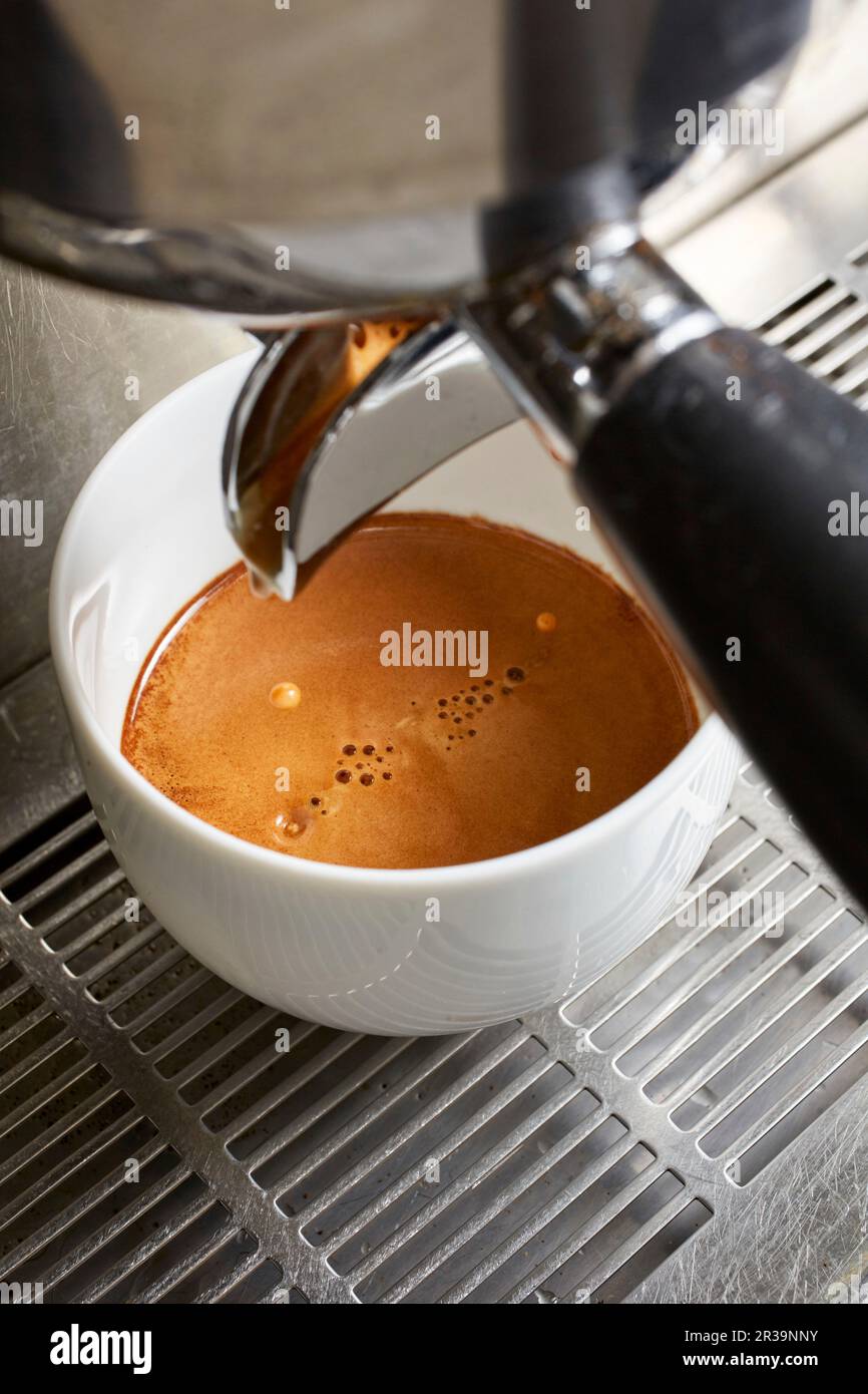 Creamy coffee from a coffee maker Stock Photo - Alamy