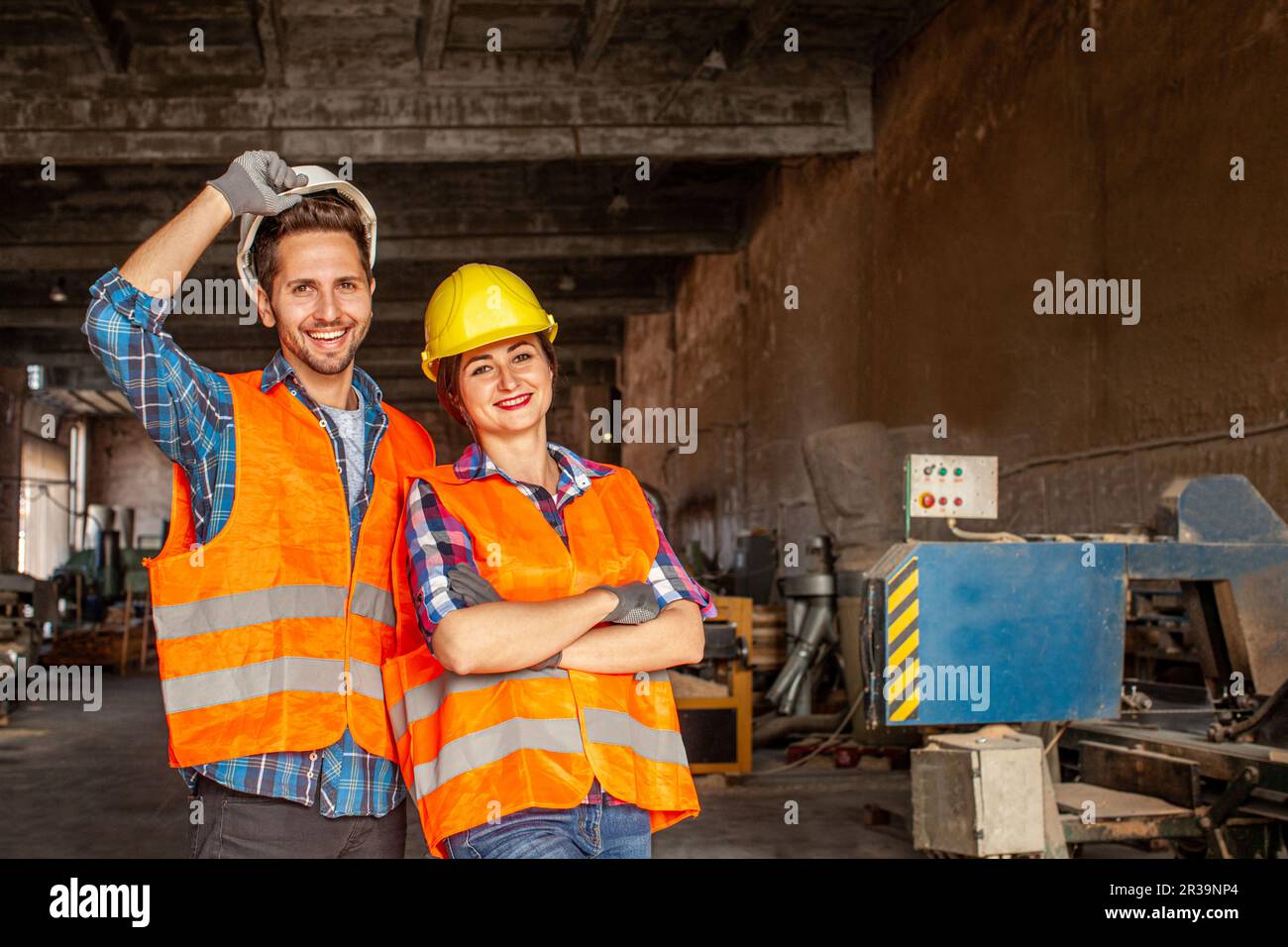 Happy factory workers indoors old factory shop Stock Photo - Alamy