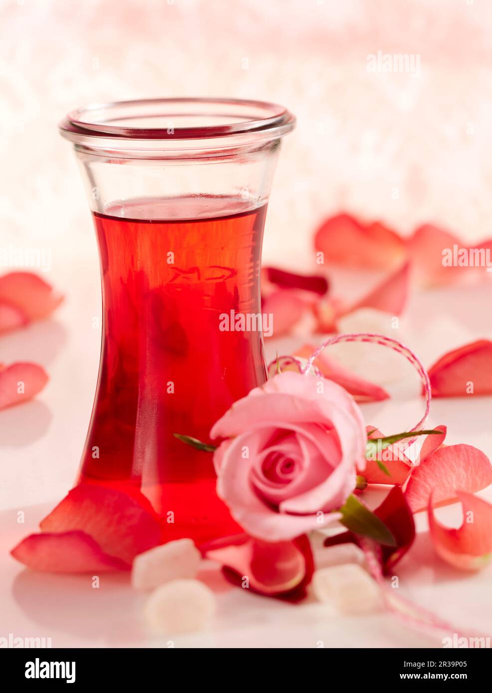 Homemade rose liqueur with fresh rose petals Stock Photo - Alamy