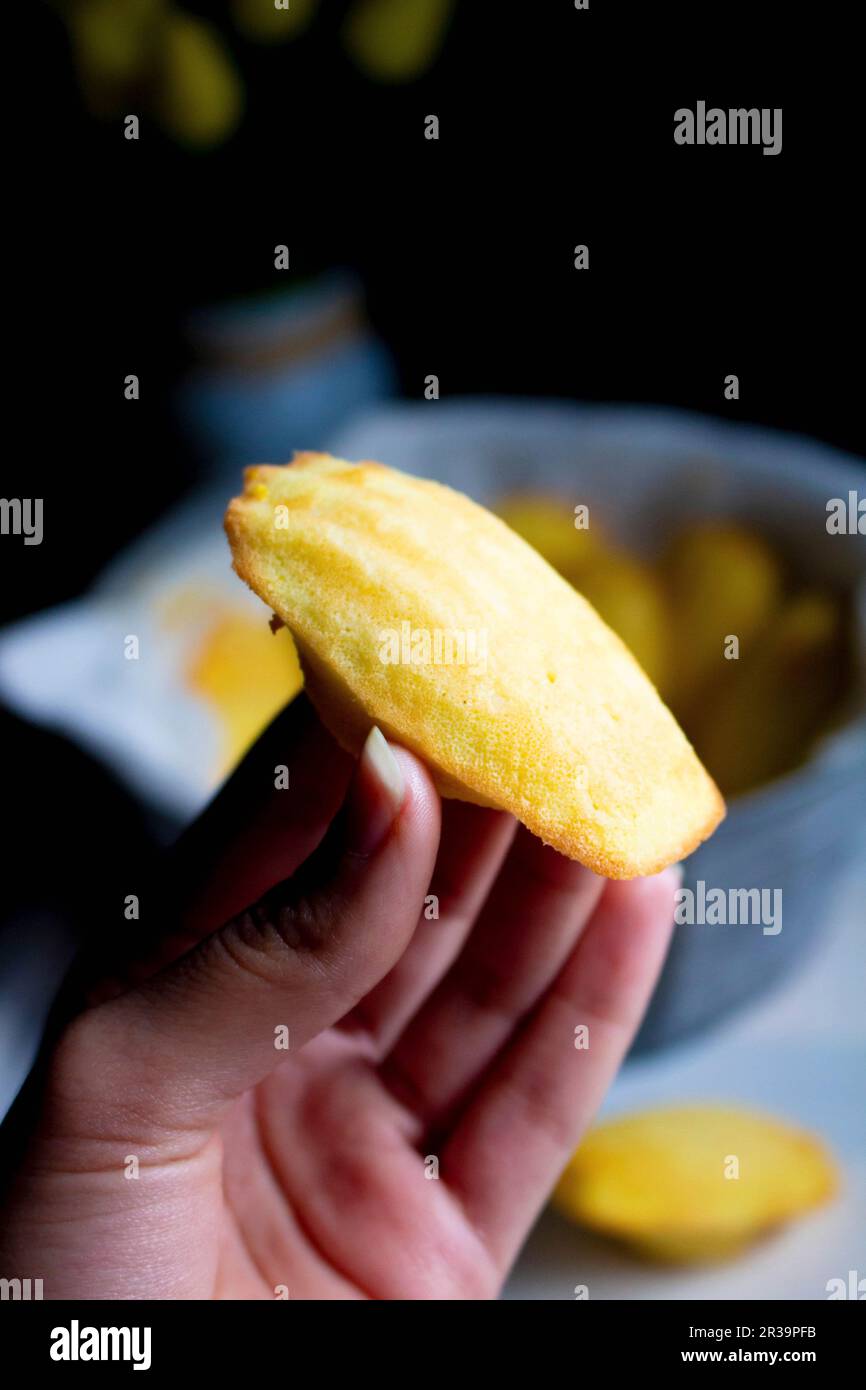 Hand held soft sweet cakes hi-res stock photography and images - Alamy