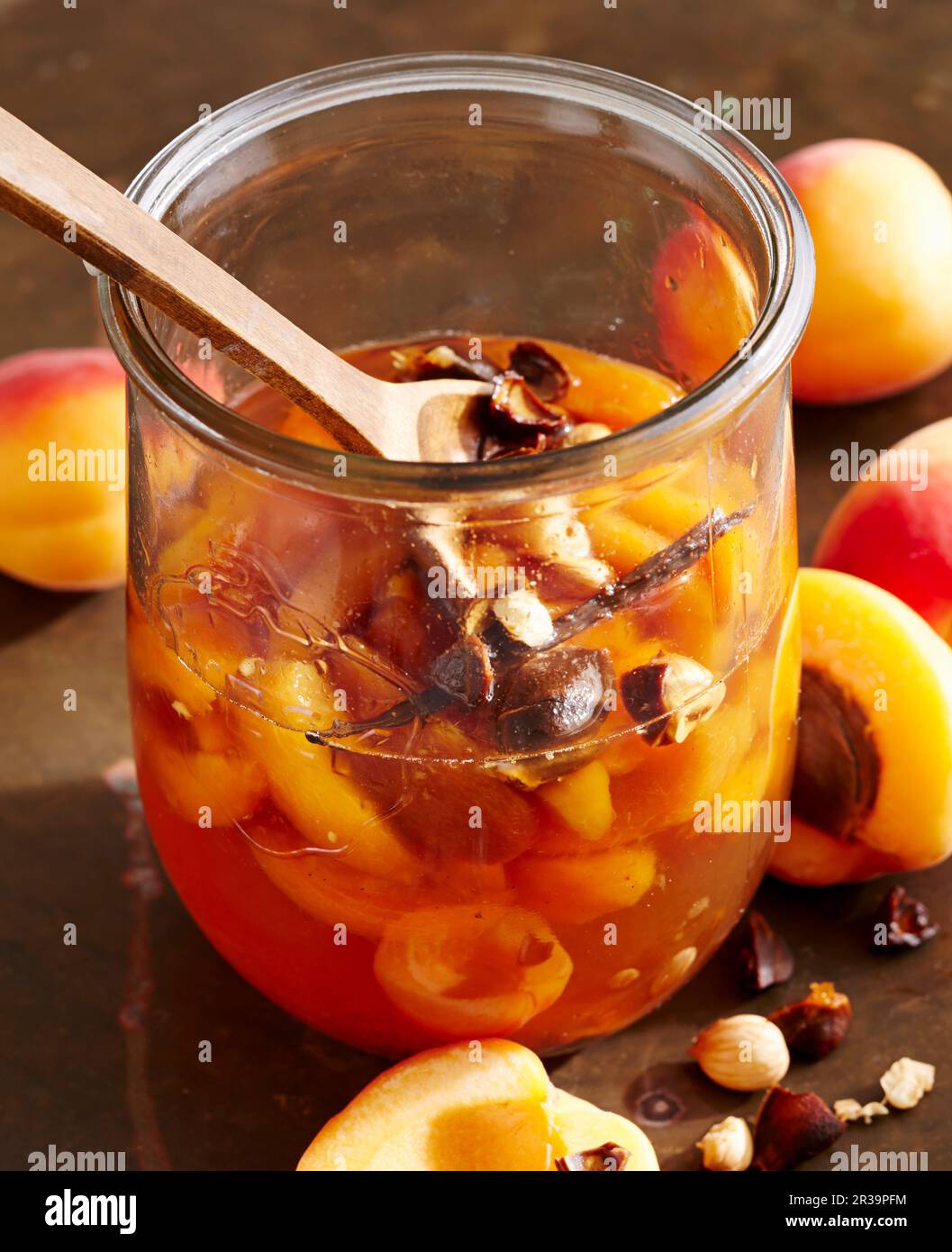 Homemade apricot liqueur with seeds, fruit, vanilla and wine spirit ...