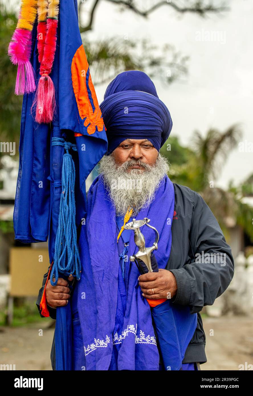 Portrait of a Sikh warrior in traditional dress with a weapon and a ...