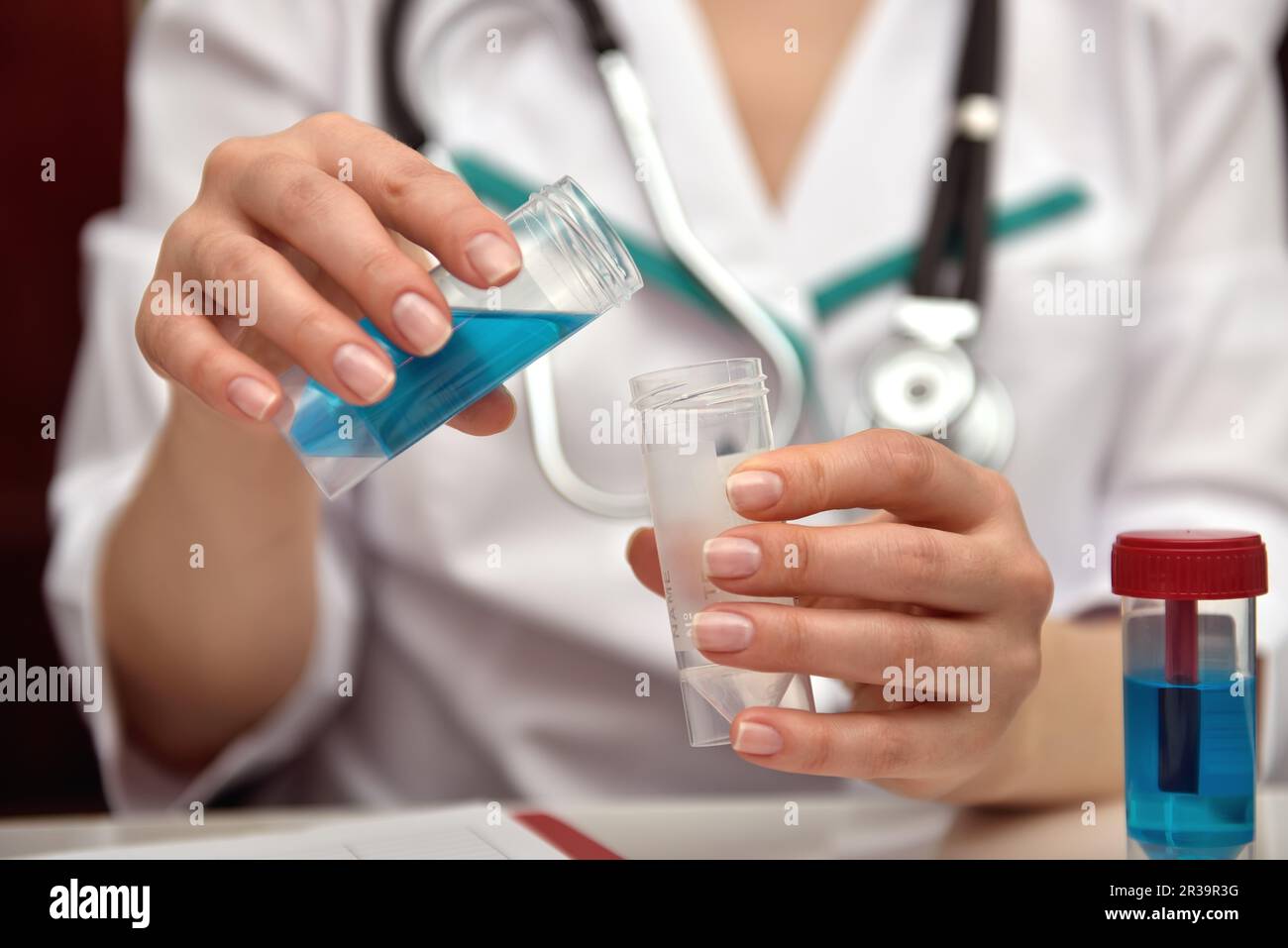 Woman scientist mixing chemicals in hi-res stock photography and images ...