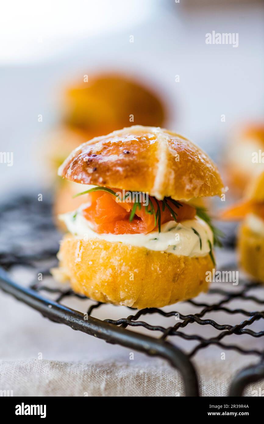 Savoury Hot Cross Bun burger with salmon and cream cheese Stock Photo ...