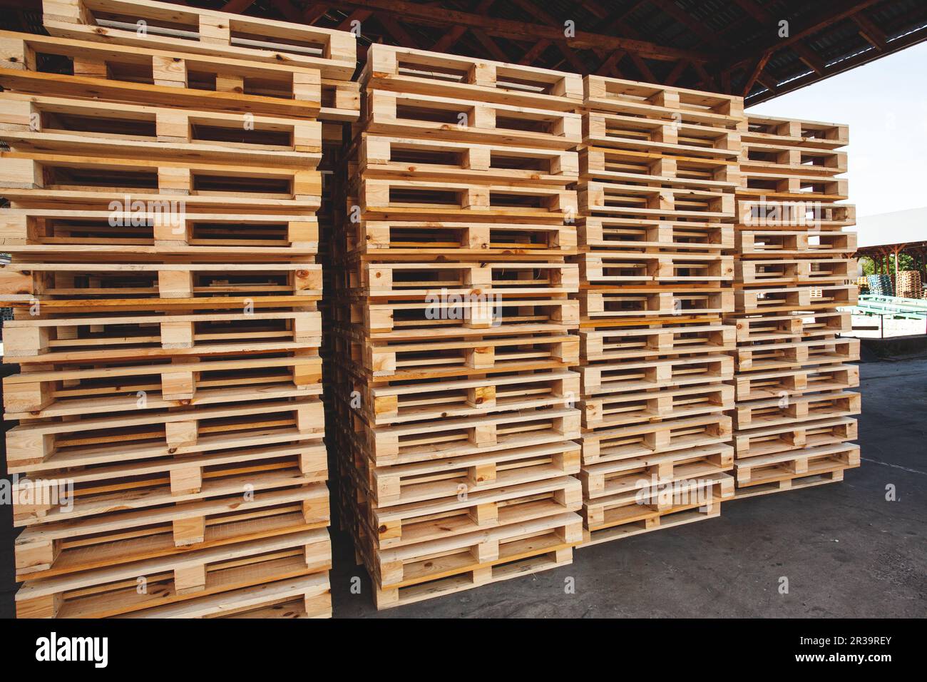 The multiple stacks of wooden pallets in the stock Stock Photo - Alamy