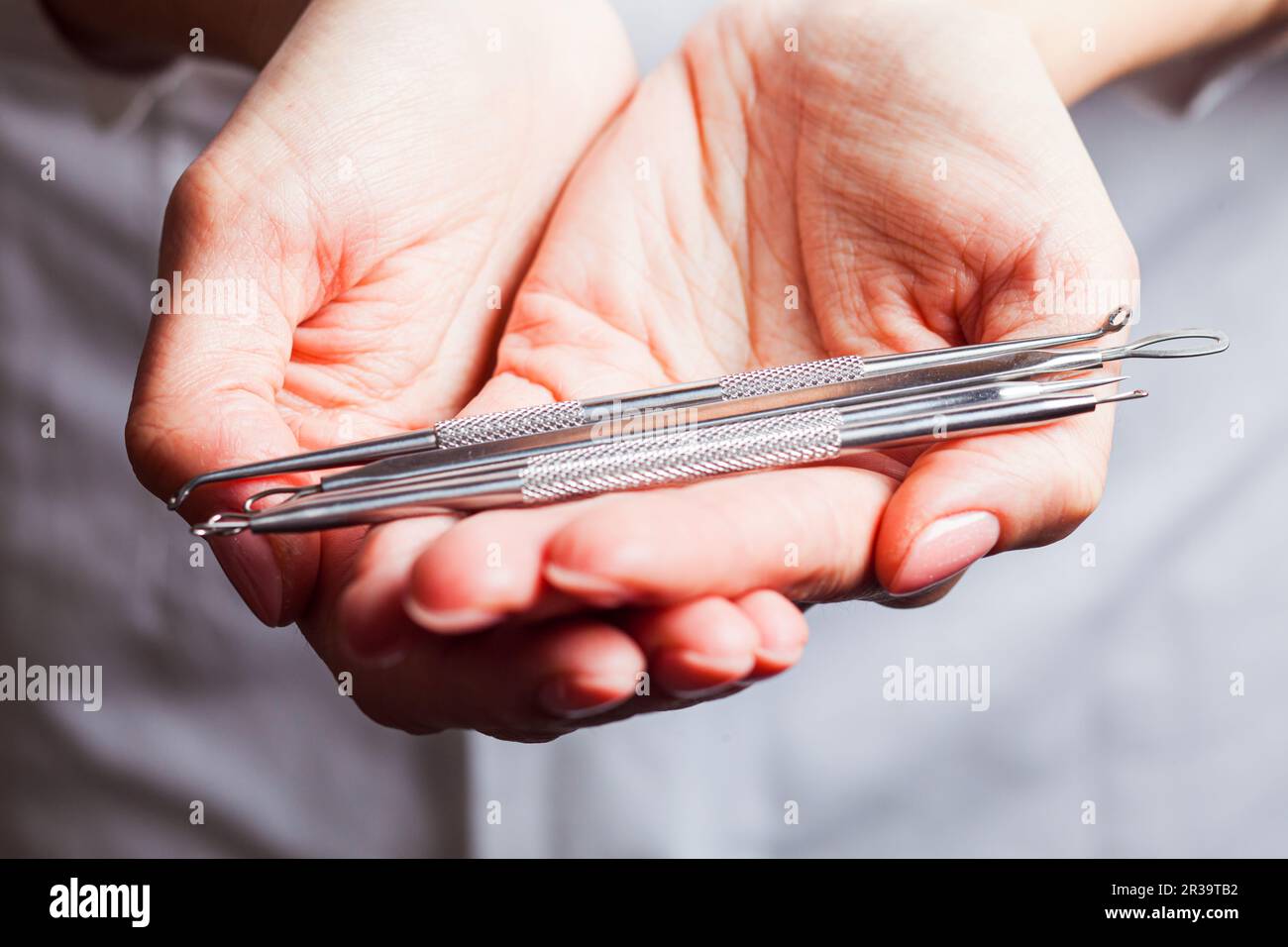 Woman is showing set of tools for professional cosmetology Stock Photo ...