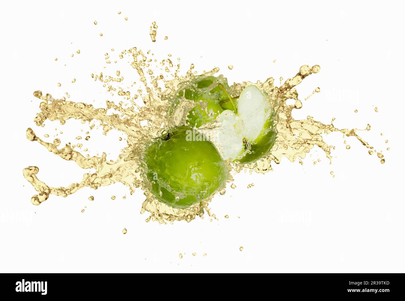 Green apples with an apple juice splash Stock Photo - Alamy