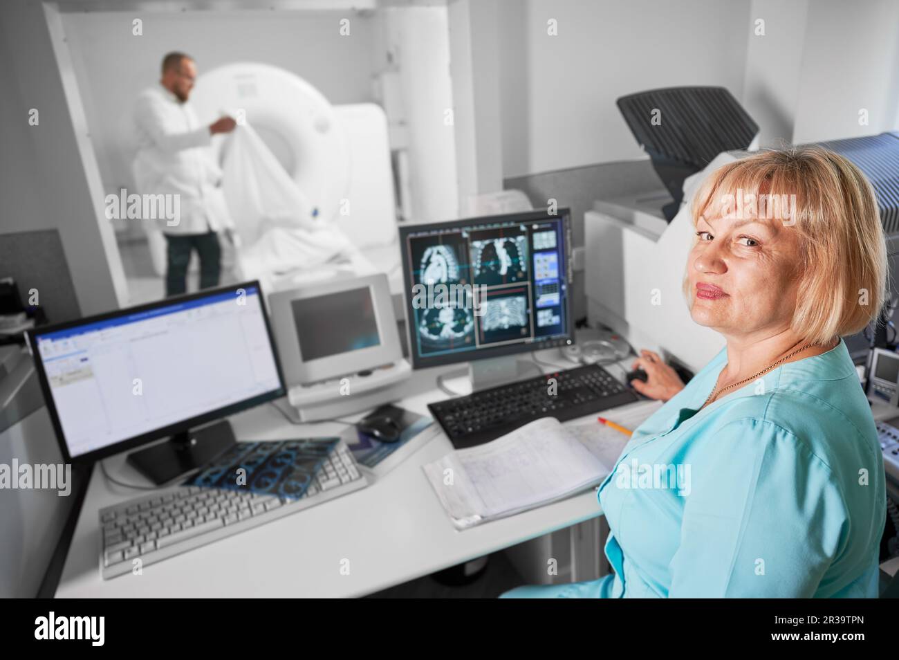 Medical computed tomography or MRI scanner. Portrait of female nurse ...