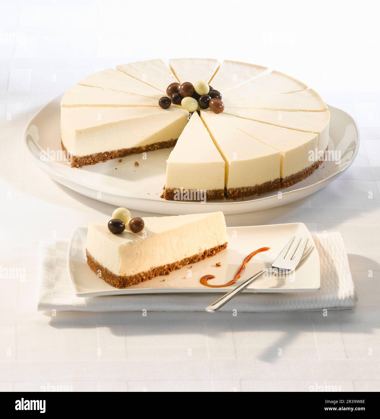 Vanilla cheesecake with a biscuit base serves fourteen Stock Photo - Alamy