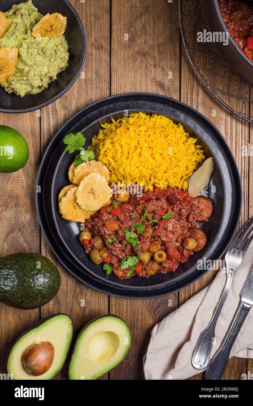 Picadillo with yellow rice and chopped plantain (Cuba Stock Photo - Alamy