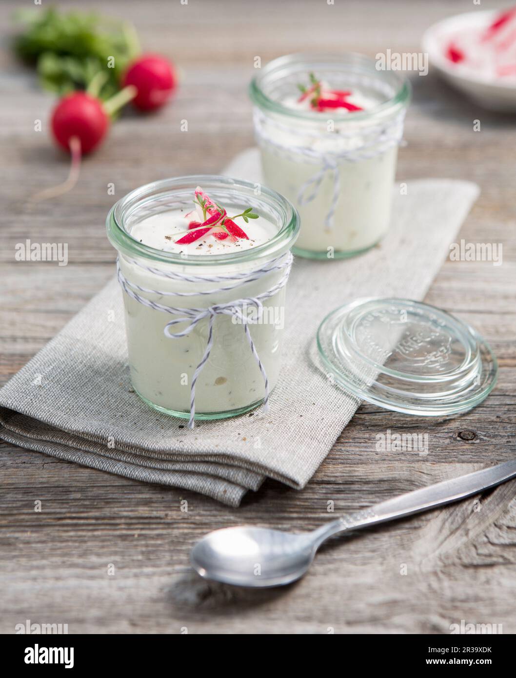 Herb quark with radishes in jars Stock Photo - Alamy
