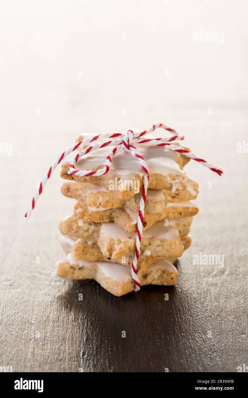 A stack of cinnamon stars tied with string Stock Photo - Alamy