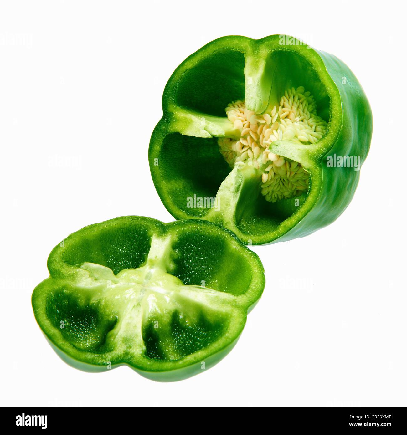 A green pepper with the top sliced in front of white background Stock ...