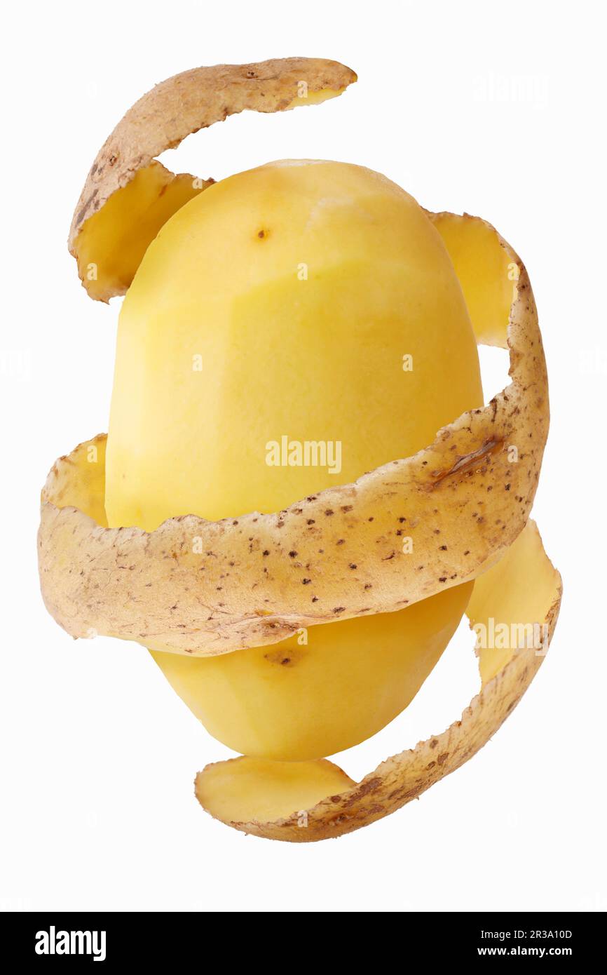 A peeled potato with potato peel Stock Photo - Alamy