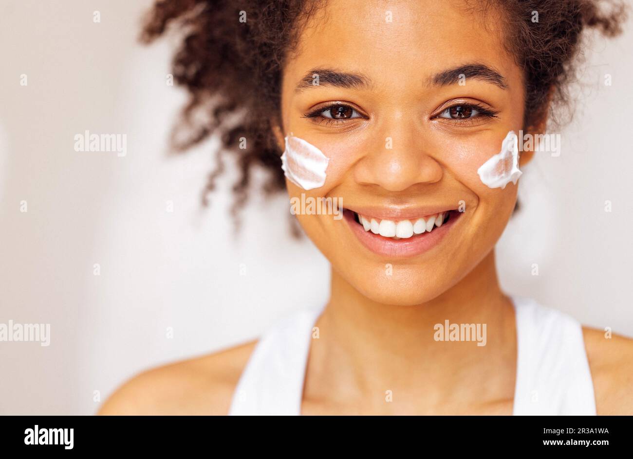 Close up beauty portrait of laughing african with wavy hair and ...