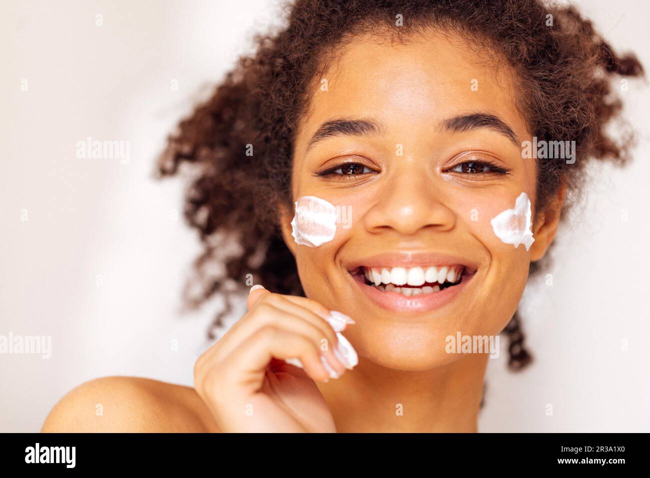 Close up beauty portrait of laughing african with wavy hair and ...