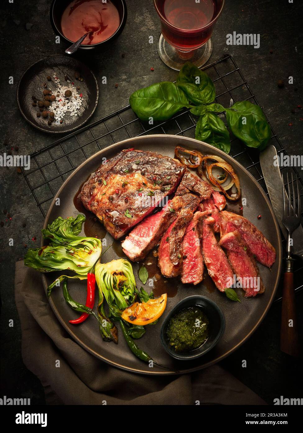 Beef steak, sliced, with bok choy and chilli Stock Photo - Alamy