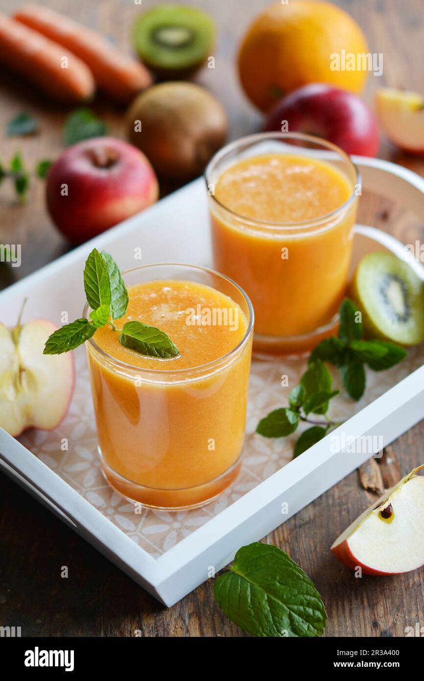 Glasses of orange juice on tray hi-res stock photography and images - Alamy