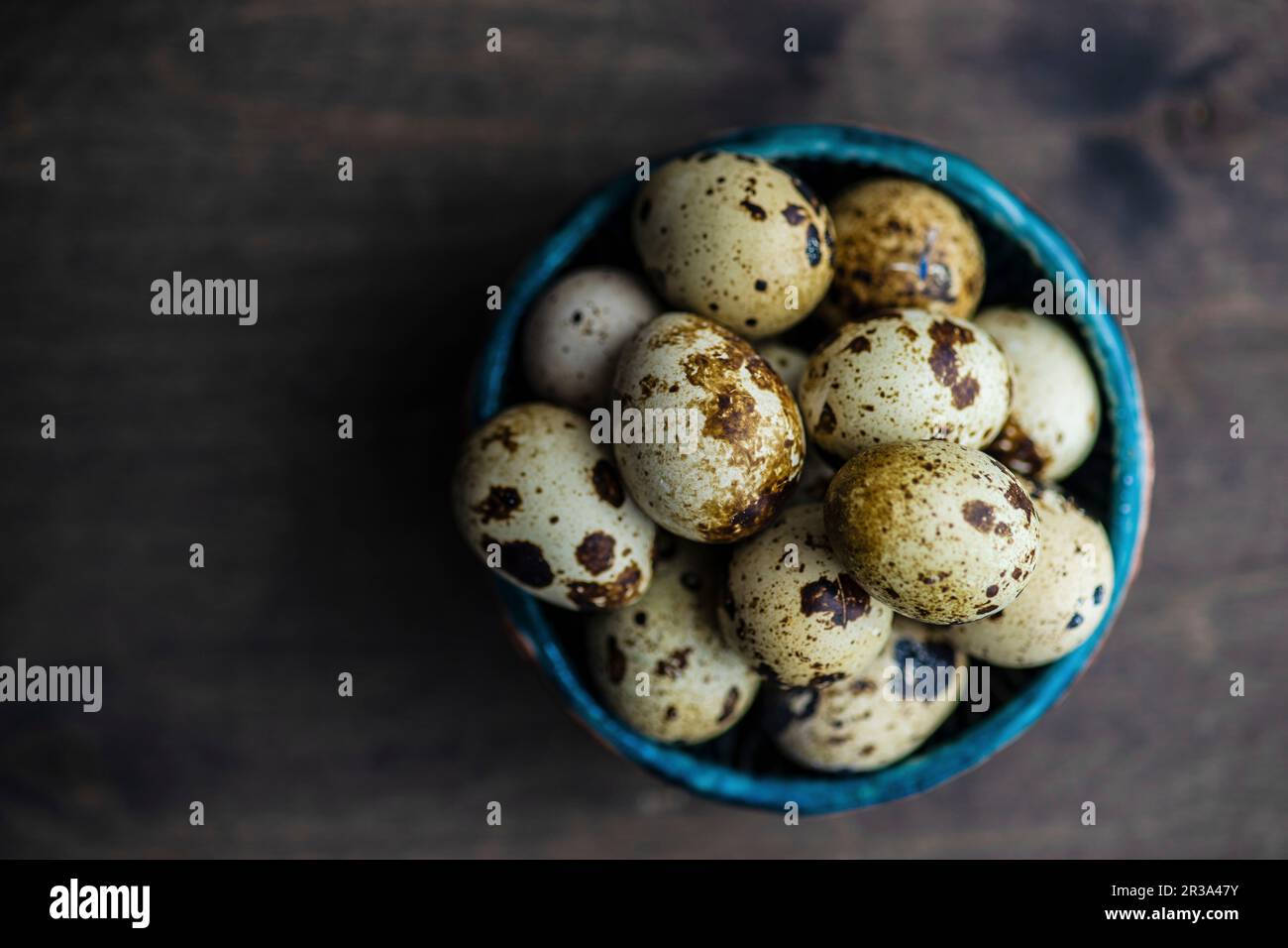 Common quail eggs in a bowl Stock Photo - Alamy