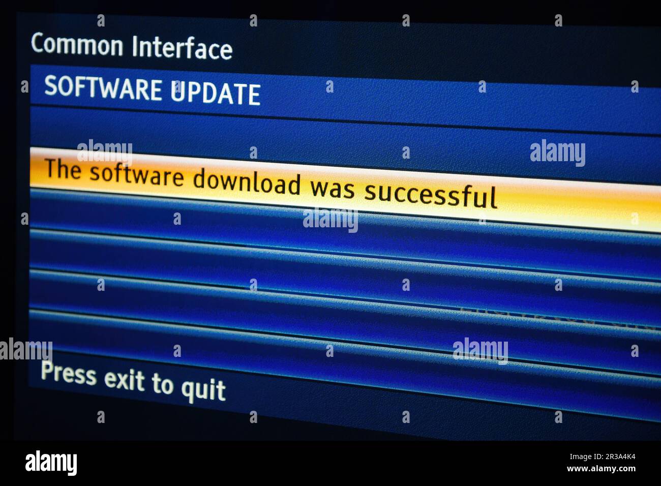 A modern TV set with a blue menu displays a successful software ...