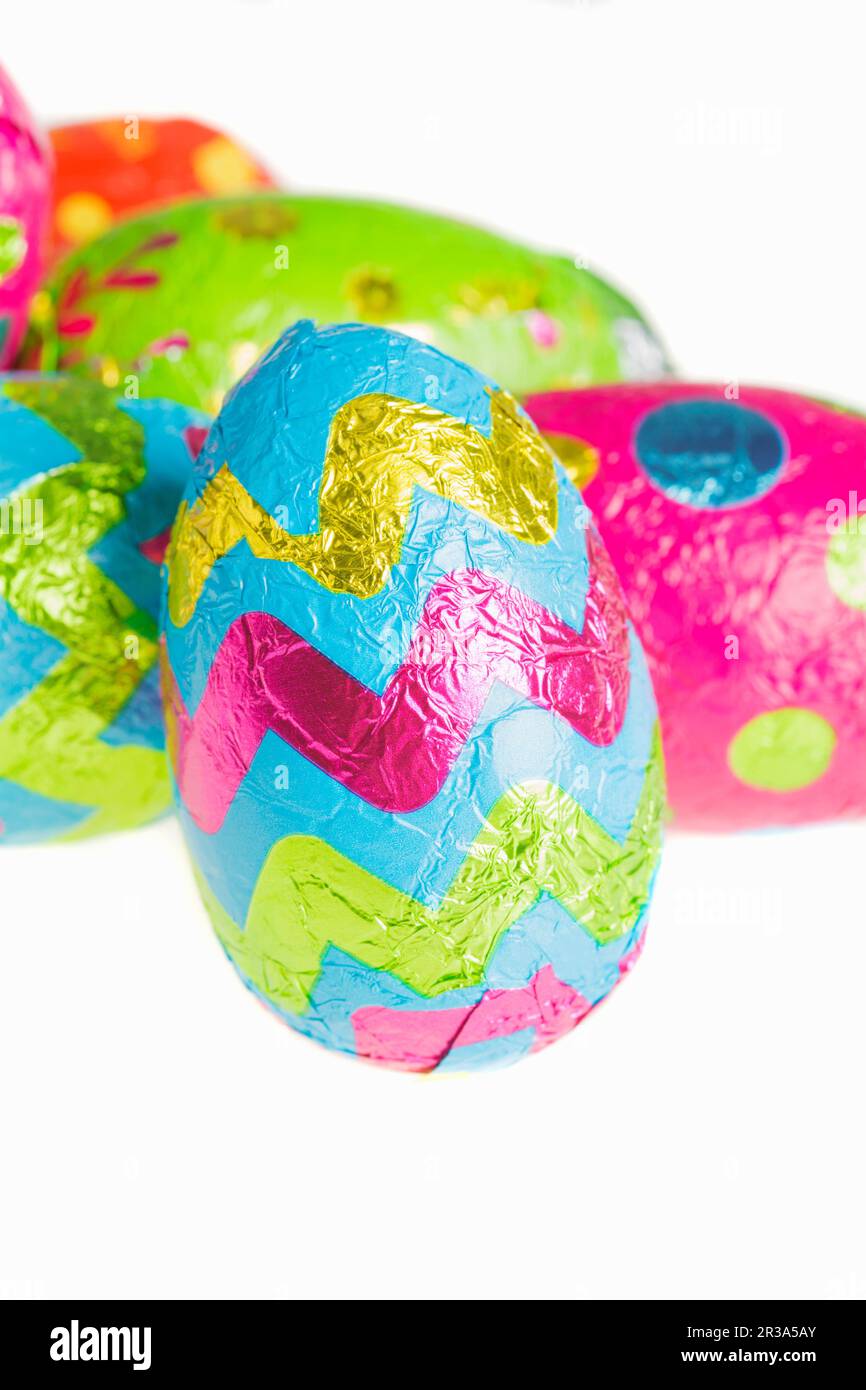 Chocolate Easter eggs wrapped in colourful foil Stock Photo - Alamy