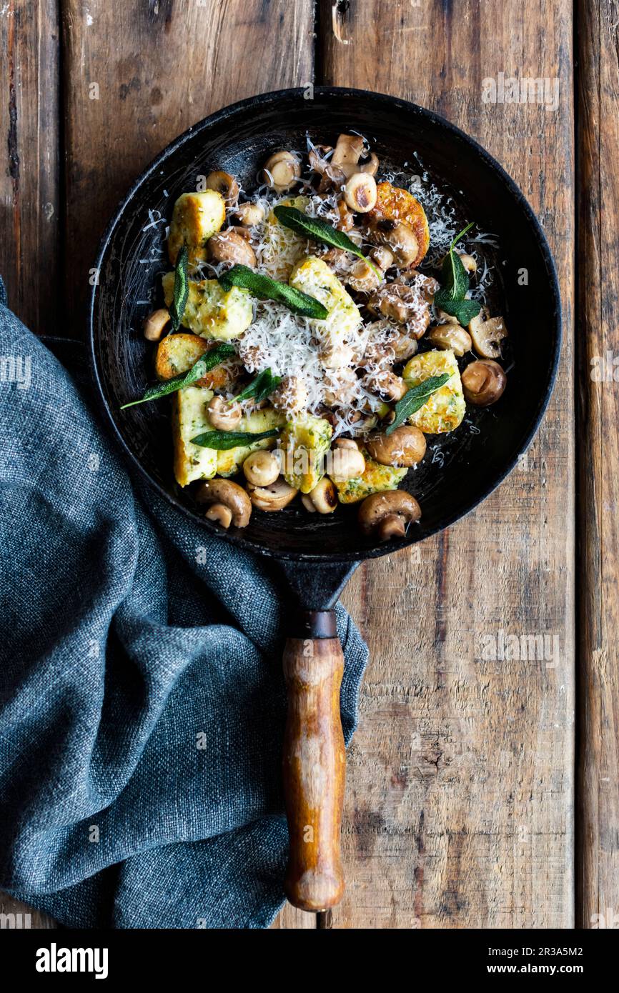 Fried ricotta gnocchi with mushrooms Stock Photo - Alamy