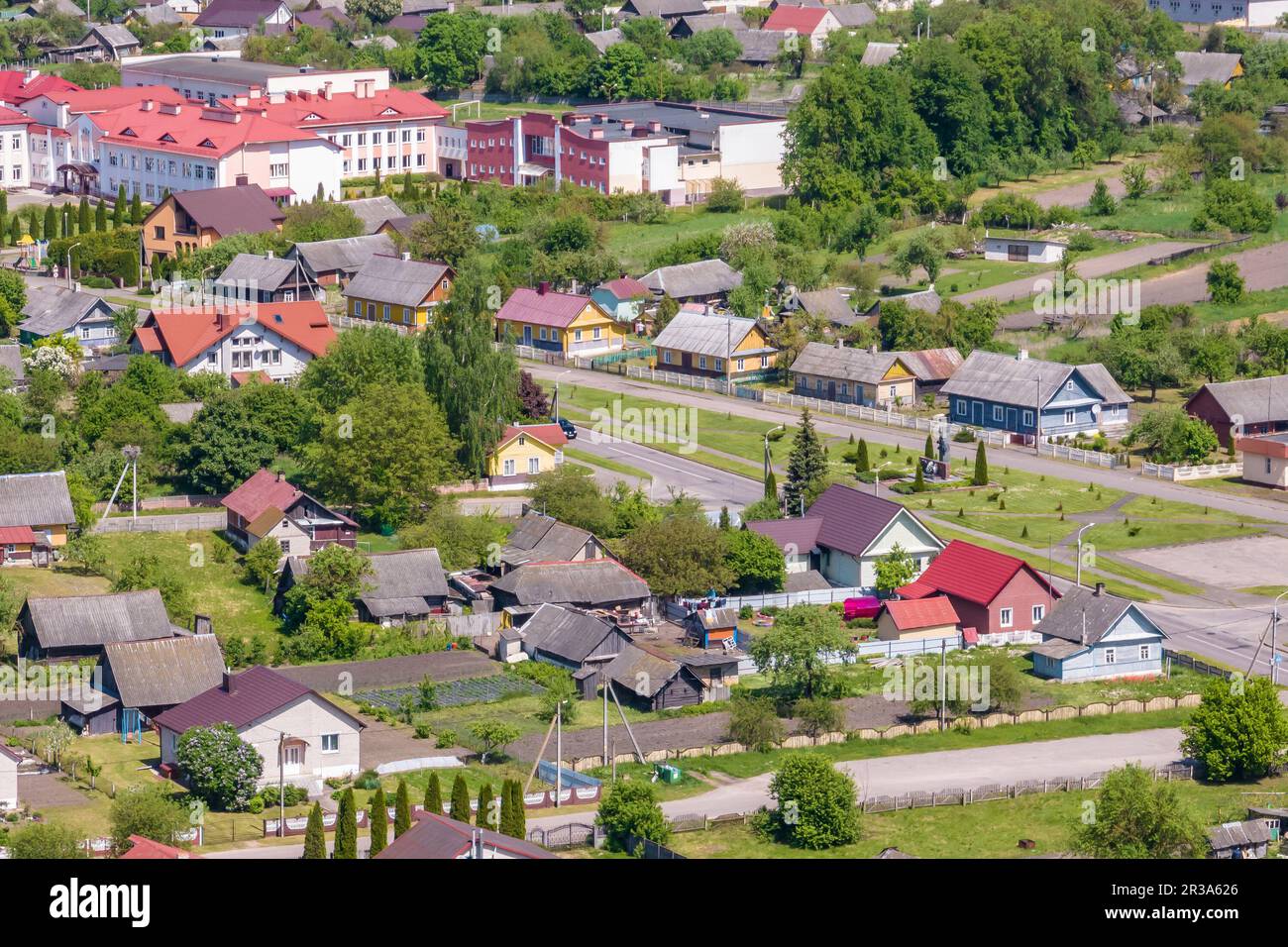 panoramic aerial view of a small urban-type settlement with red roofs ...