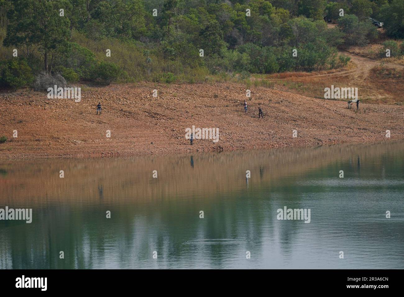 Personnel at Barragem do Arade reservoir, in the Algave, Portugal, as ...