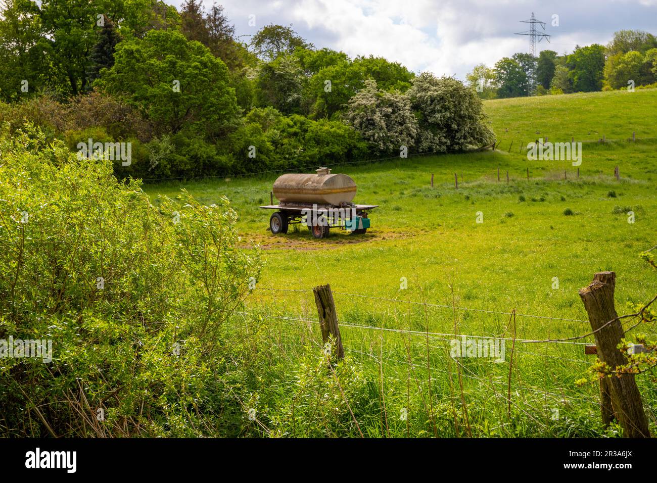 Water tank on an animal pasture Stock Photo - Alamy