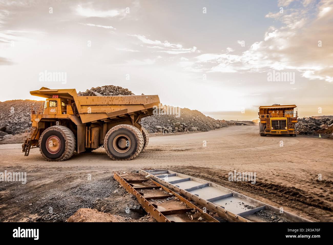 Mining dump trucks transporting Platinum ore for processing Stock Photo ...