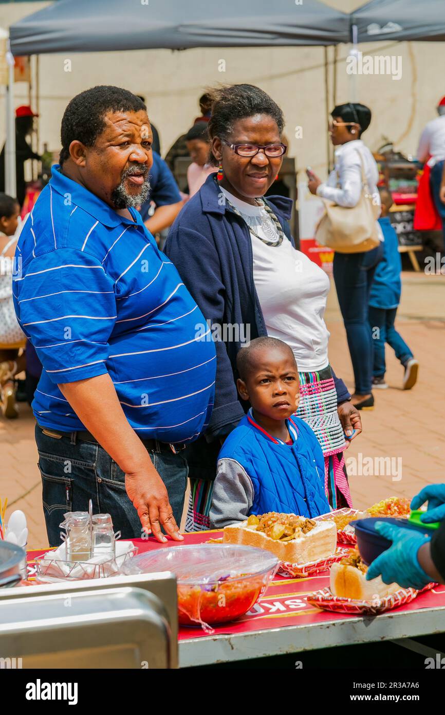 Diverse African vendors cooking and serving various bread based street ...