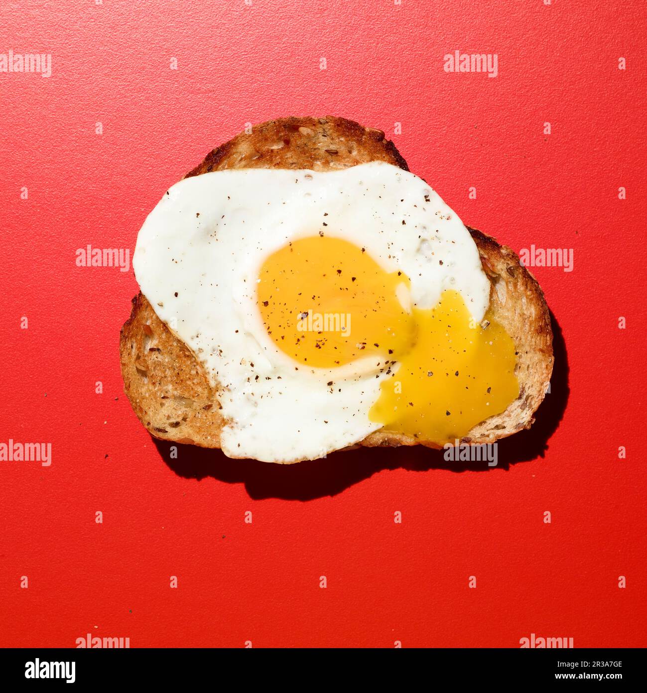 Yolk running on toast Stock Photo - Alamy