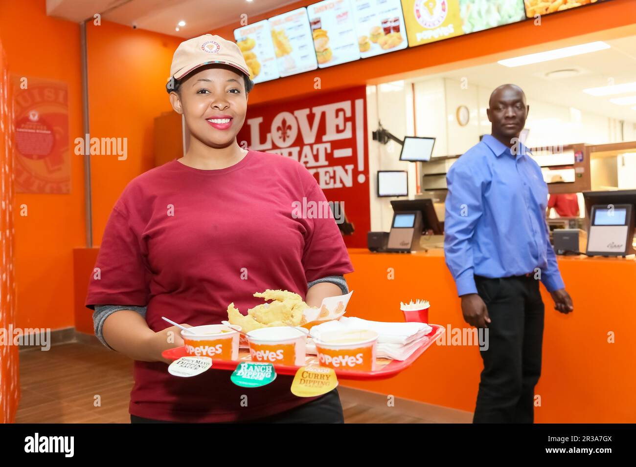 Staff at a Popeyes Take Out Fast Food Restaurant Stock Photo - Alamy
