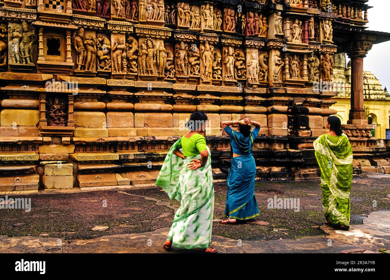 Women observing the reliefs. Jaini Parsvanath Temple. Khajuraho ...