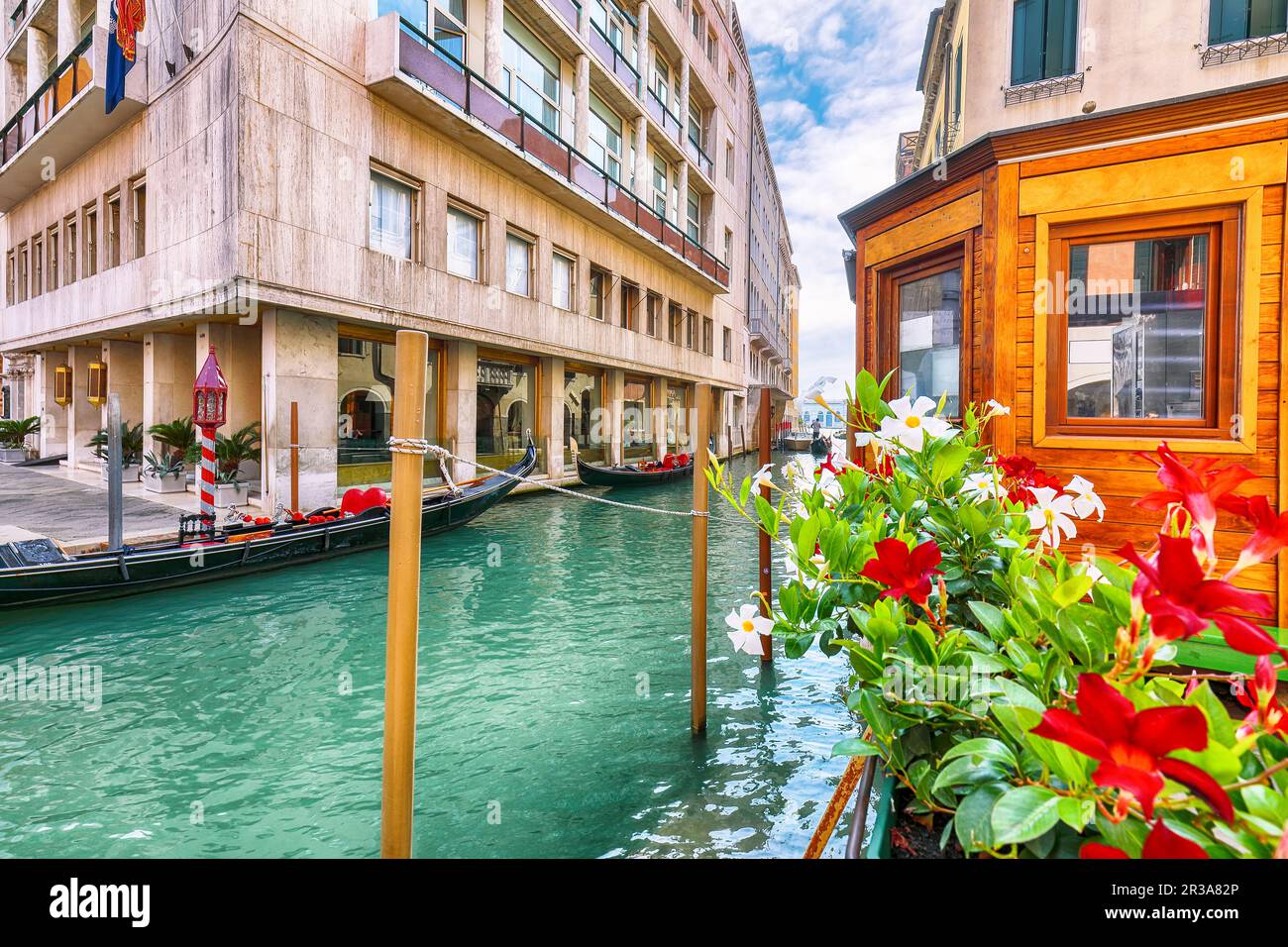 Gorgeous cityscape of Venice with narrow canals, boats and gondolas and ...