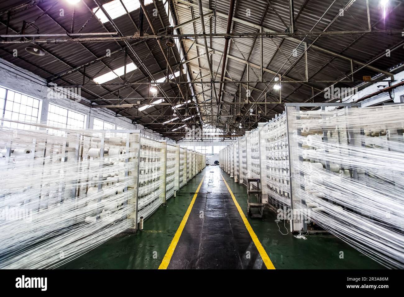 Cotton Thread lines for a copwinder weft assembly line loom Stock Photo ...