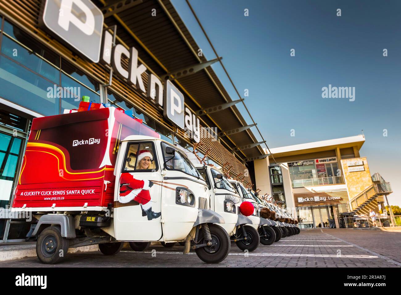 Small TukTuk Grocery Store Home Delivery Vehicles lined up at a ...
