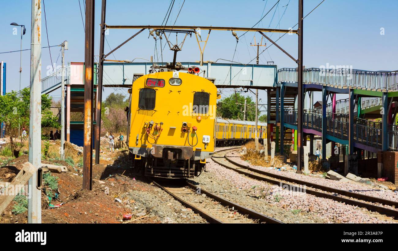 Commuter Train moving through the heart of Soweto, Johannesburg Stock ...