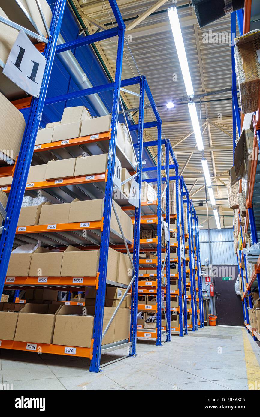 Empty shelving racks in new distribution warehouse hi-res stock ...