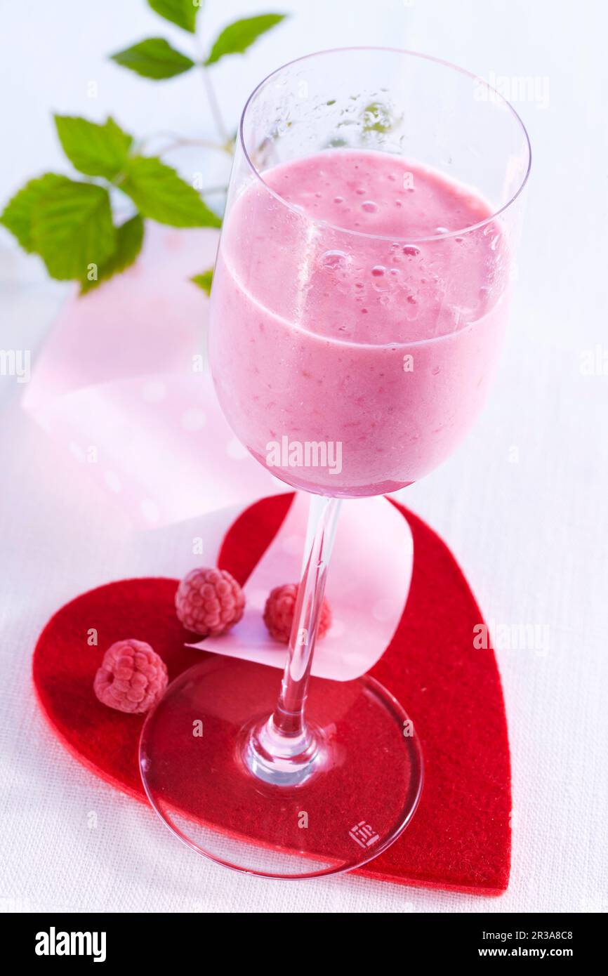 Raspberry milkshake made with fresh raspberries and honey Stock Photo ...