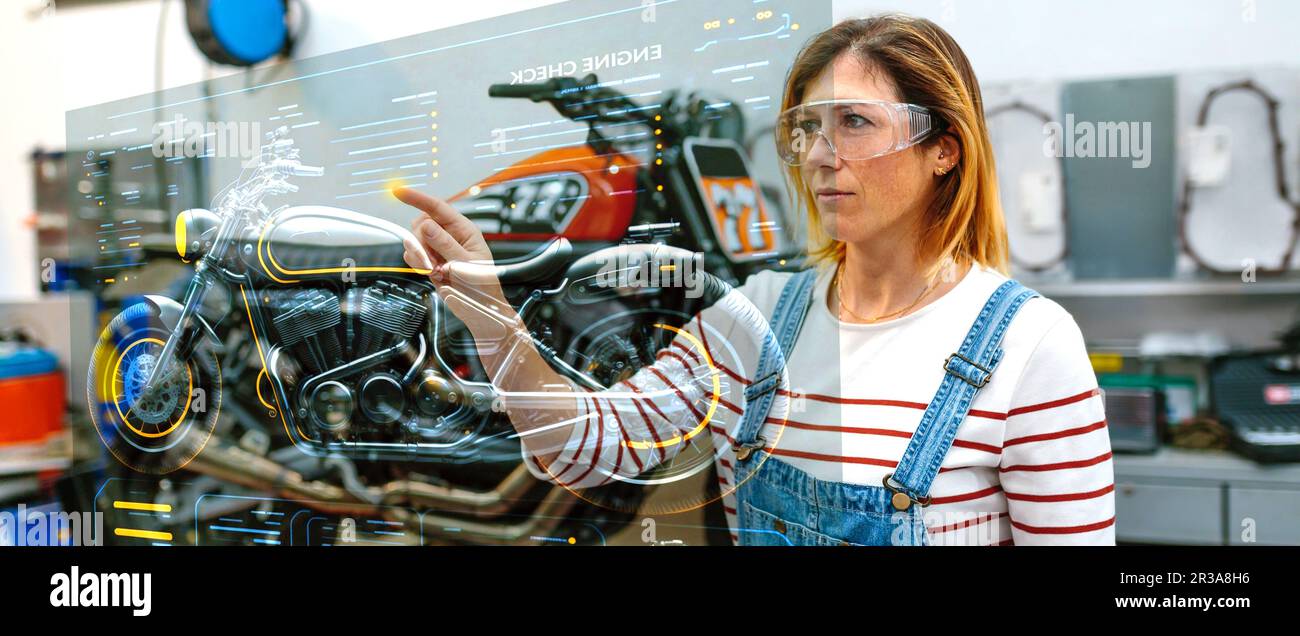 Female mechanic using hud panel screen with augmented reality hologram ...