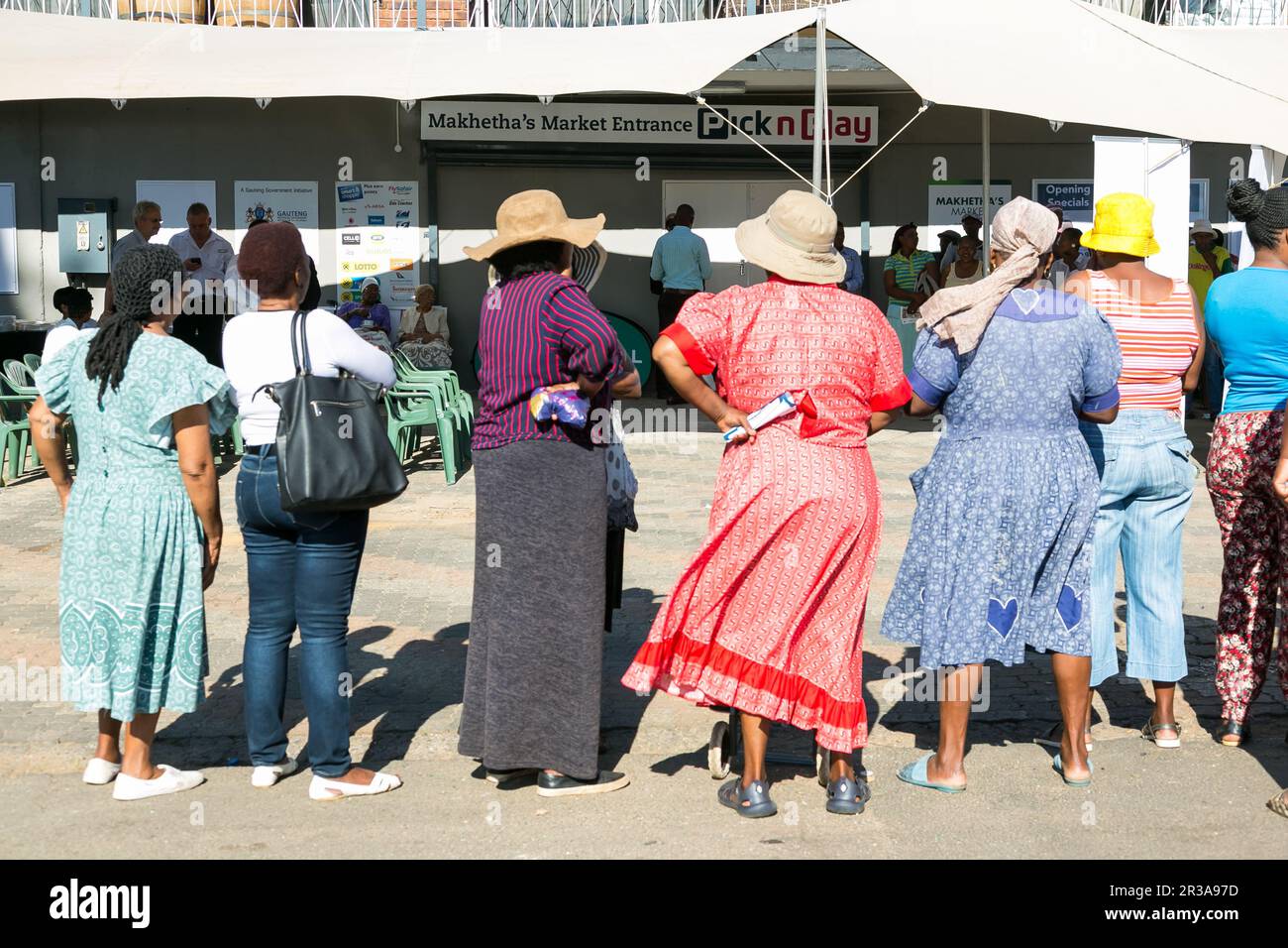 Customers waiting in line at entrance to local Pick n Pay grocery store ...