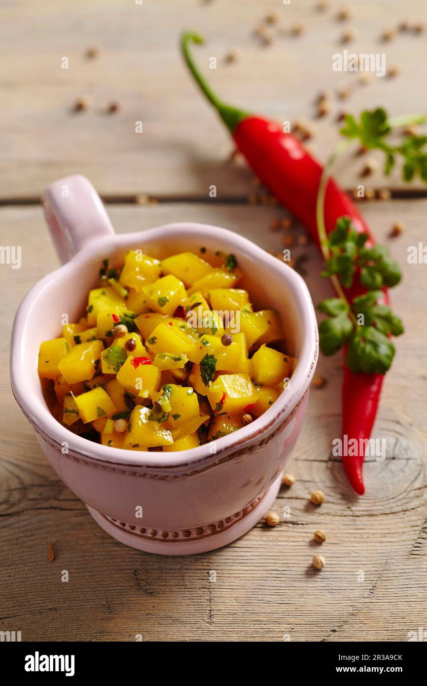 Mango pickles with spices and chili Stock Photo - Alamy