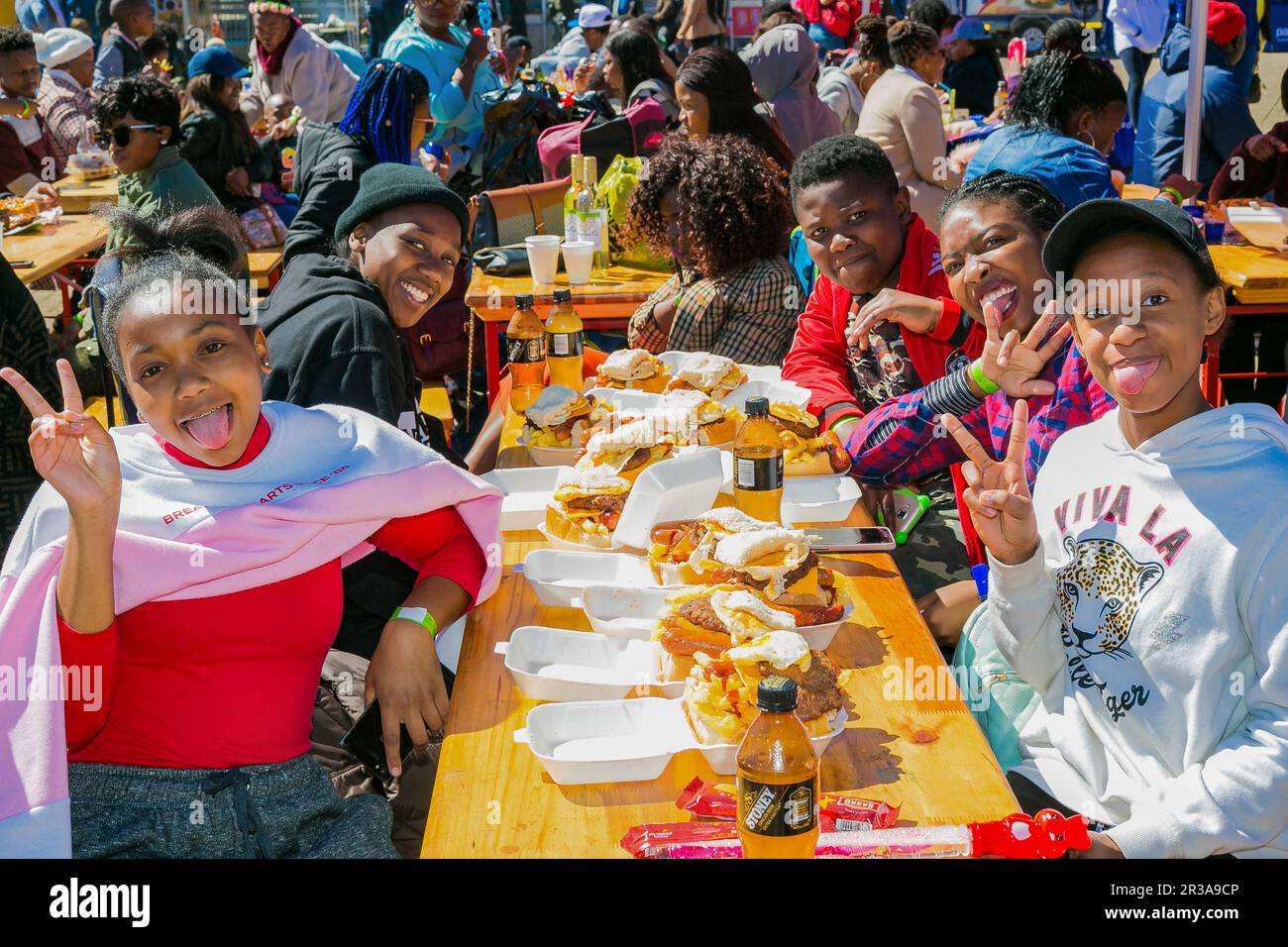 Diverse African people at a bread based street food outdoor festival ...