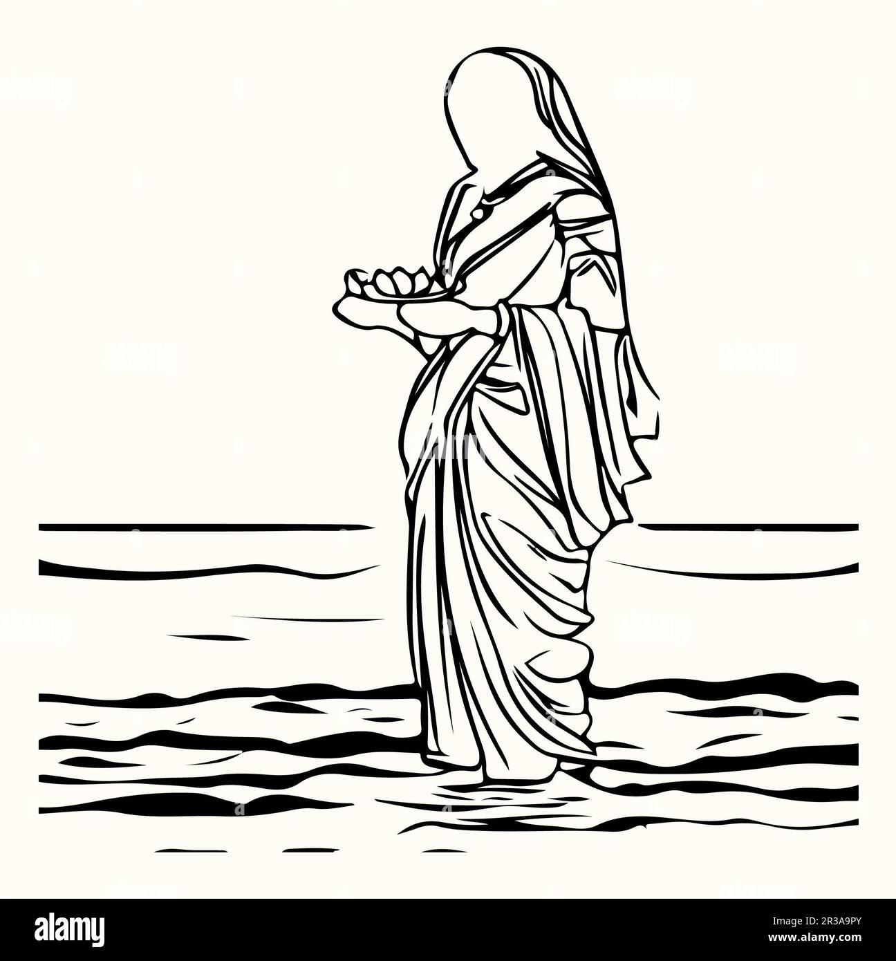 Woman dressed in a sari carrying out a religious ceremony whilst ...