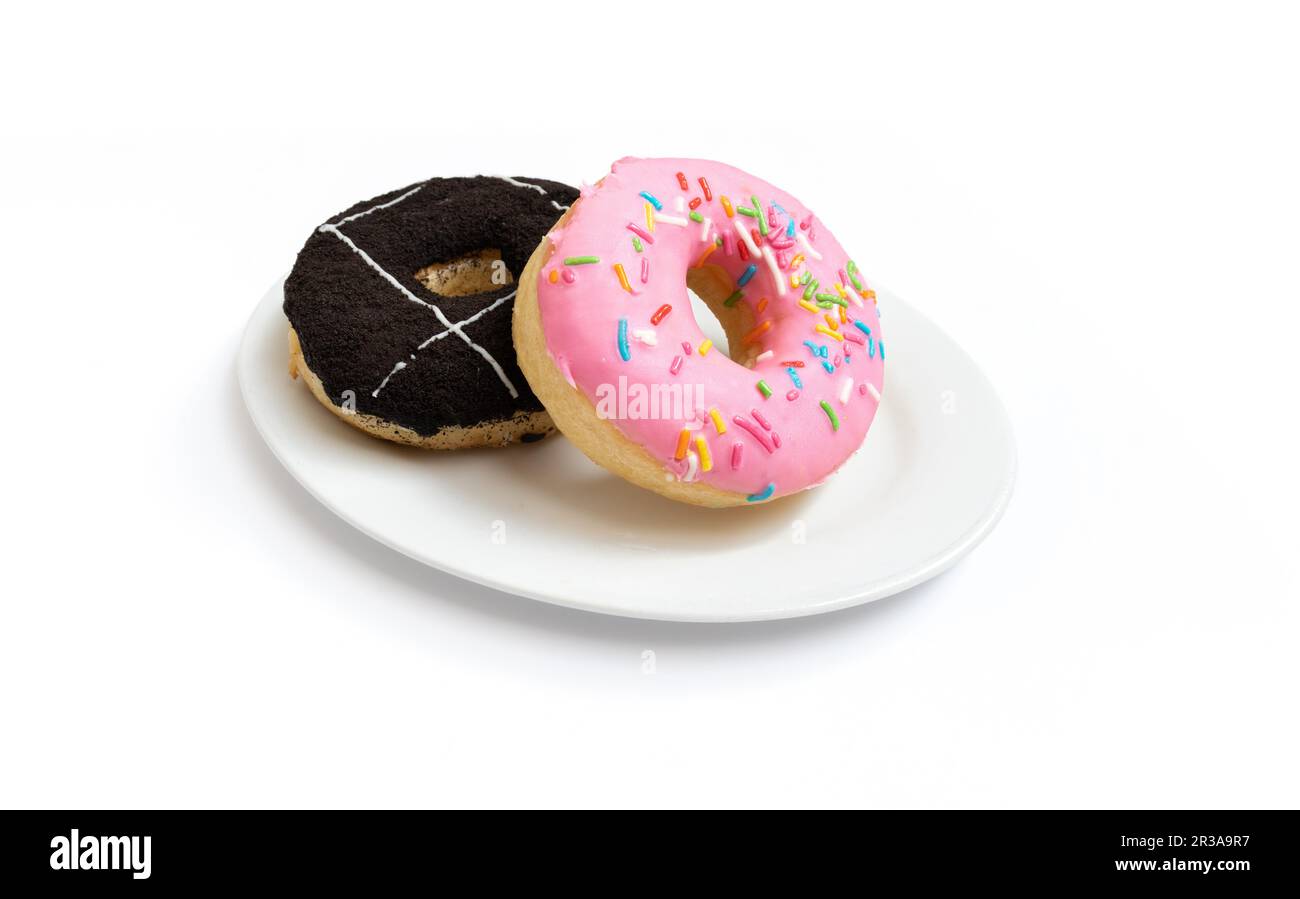 Edited photo. Messy strawberry and chocolate doughnuts on a plate ...