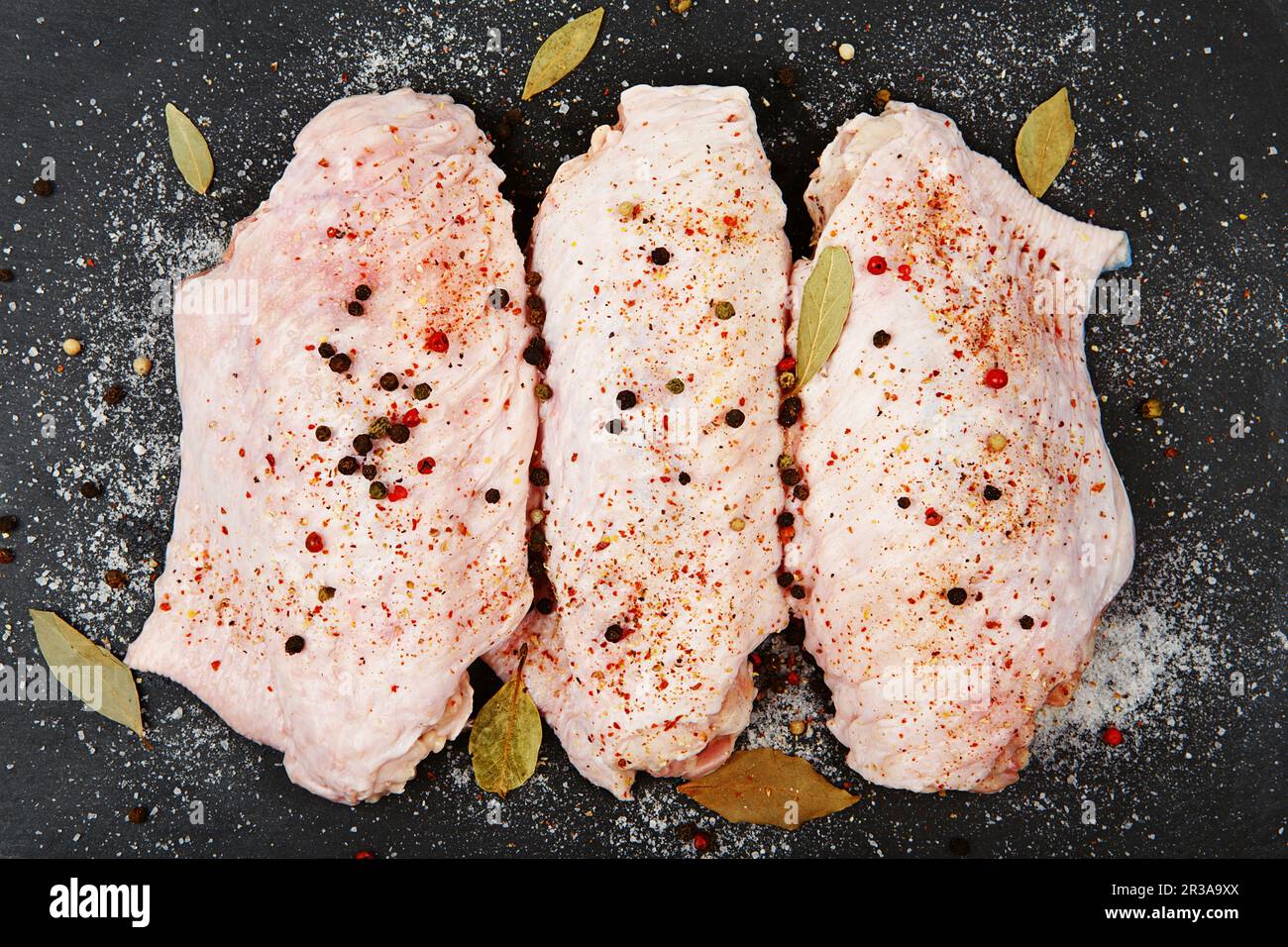 Raw turkey wings with with spices on black Slate Tray. Fresh turkey ...