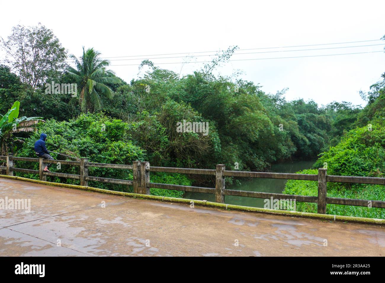 fishing from a bridge Stock Photo - Alamy