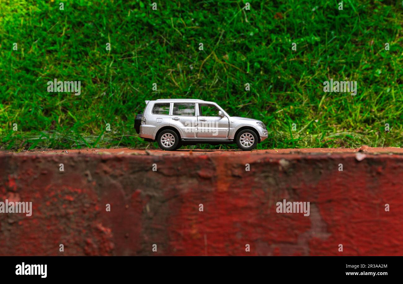 Concept for travelling with a car. Photo of a toy car placed in the ...