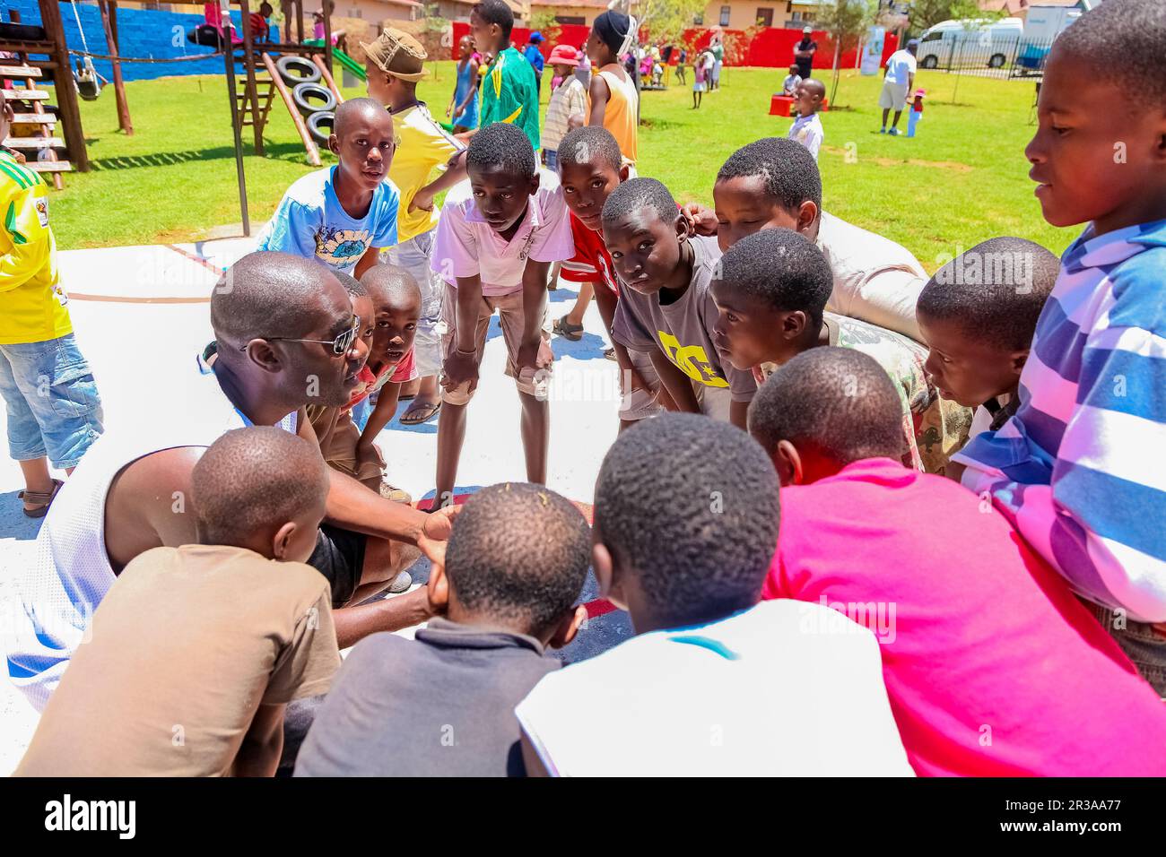 African children doing a sports team huddle on basketball court Stock ...